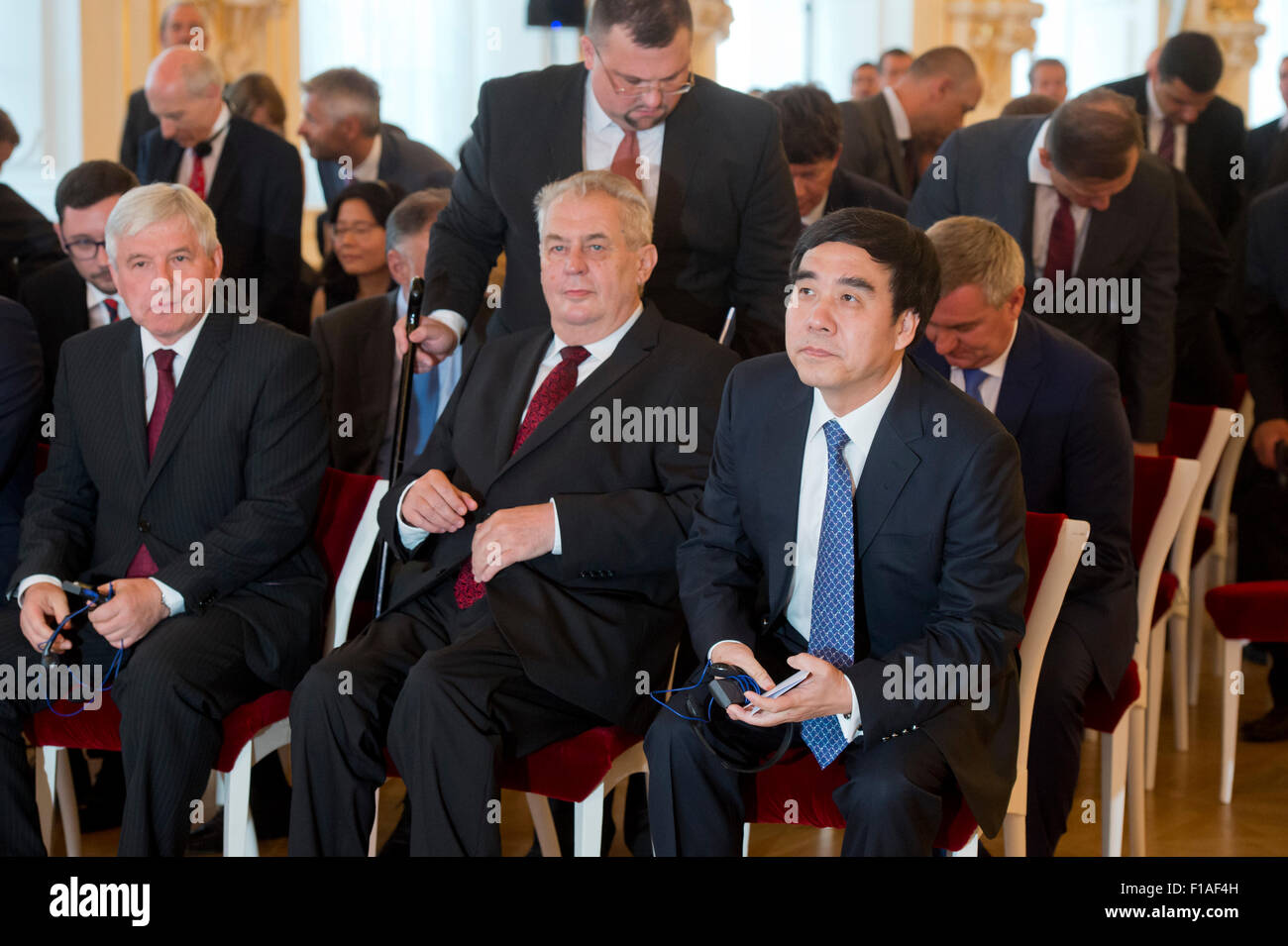 Czech President Milos Zeman, center, and board chairman of Bank of ...