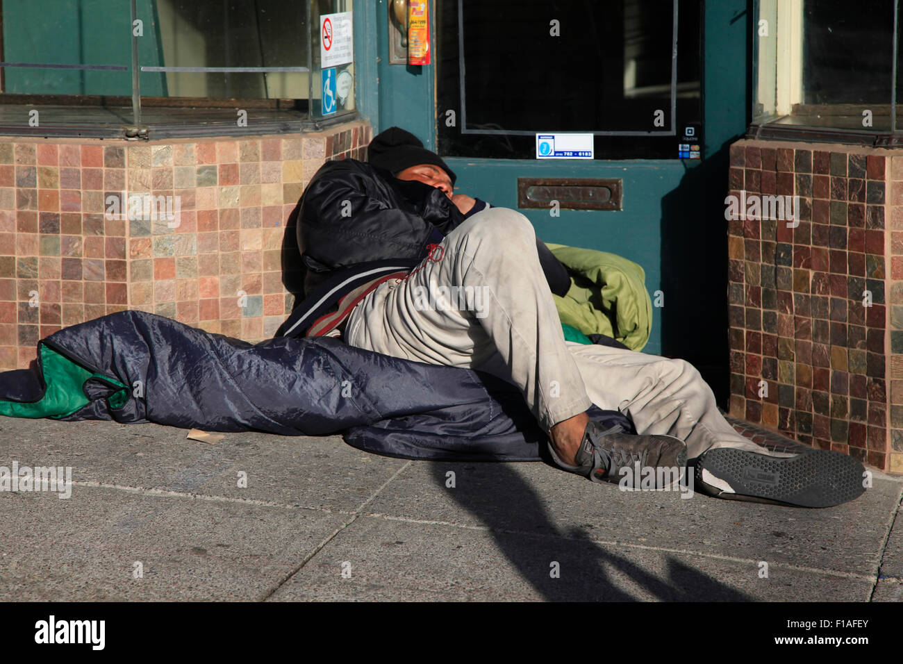San Francisco, CA, USA - October 23, 2012: Homeless man sleeps on the ...