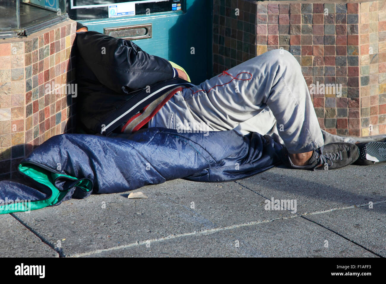 San Francisco, CA, USA - October 23, 2012: Homeless man sleeps on the ...