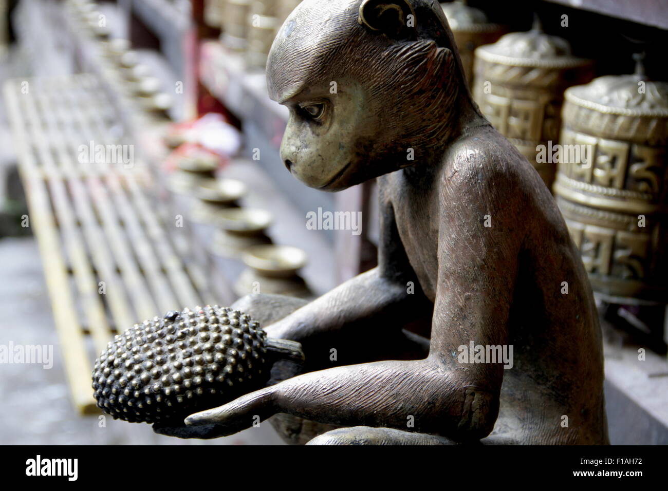 Monkey statue in a the Golden Temple in Kathmandu Stock Photo - Alamy