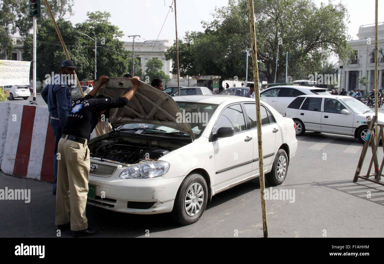 Police officials searching vehicles as the security has been tightening ...