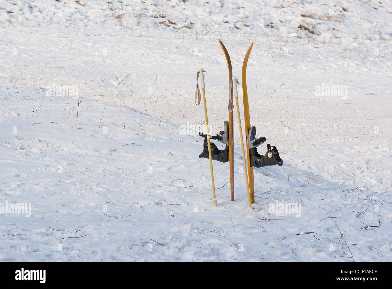 Child's skis stuck in to snow waiting for the master Stock Photo - Alamy