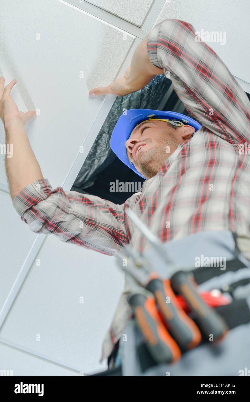 Man up a ladder Stock Photo - Alamy