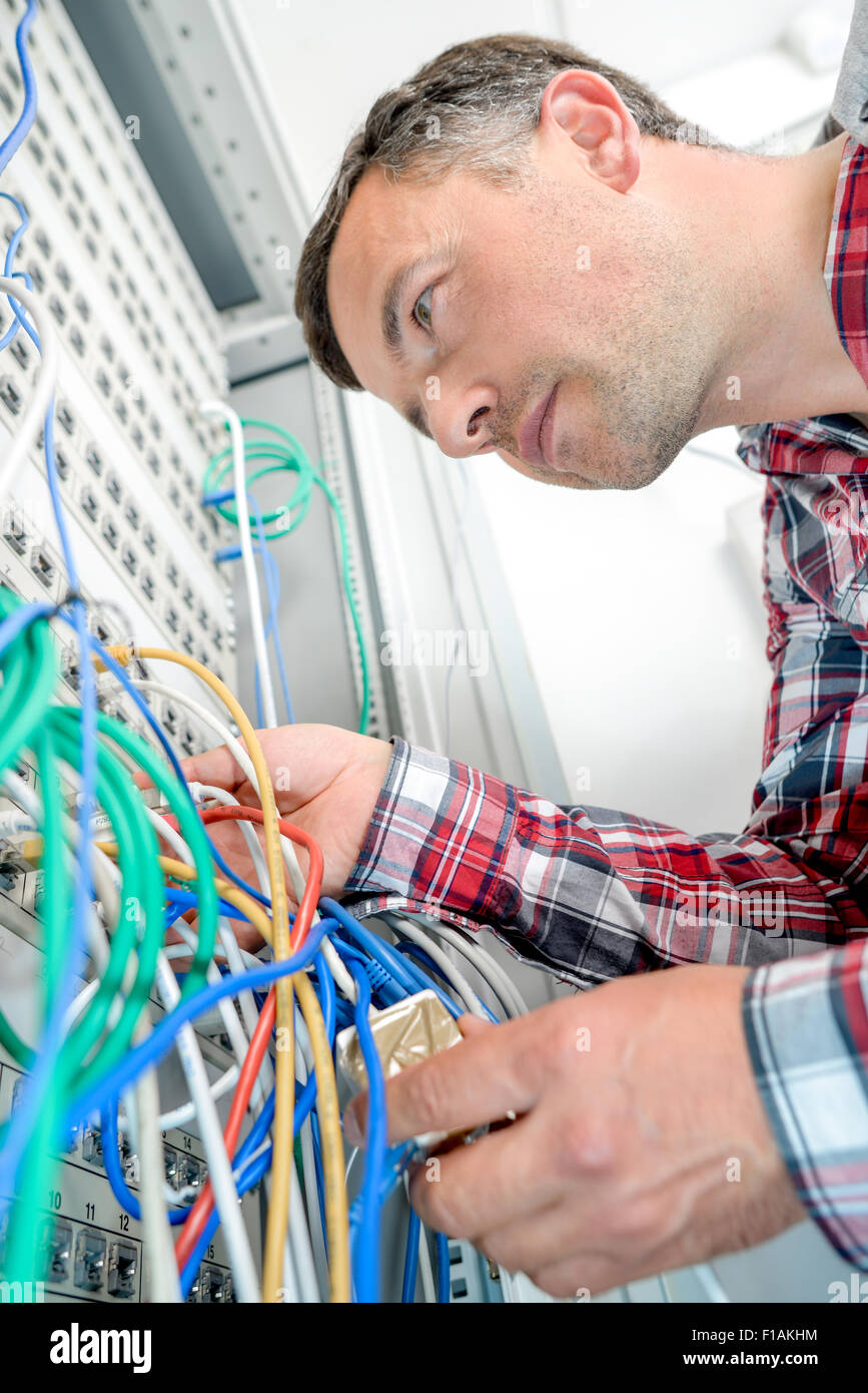 Electrician connecting cables Stock Photo - Alamy
