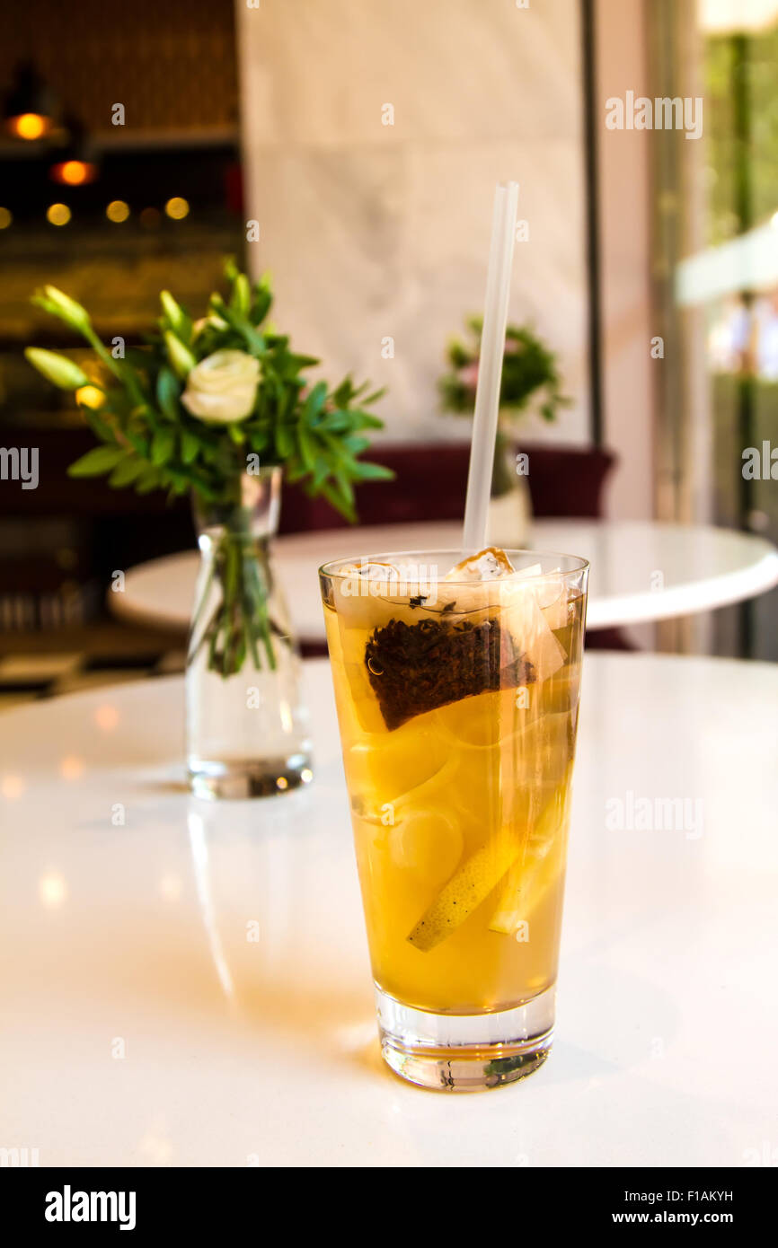 Drinking a glass of ice tea Stock Photo - Alamy