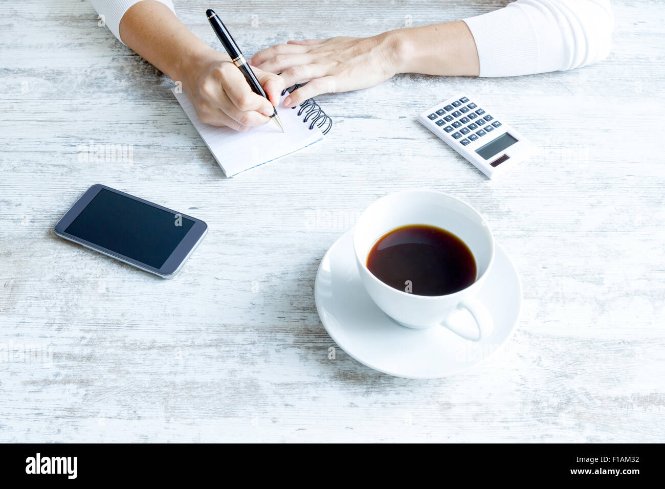 Taking some notes at the office Stock Photo - Alamy