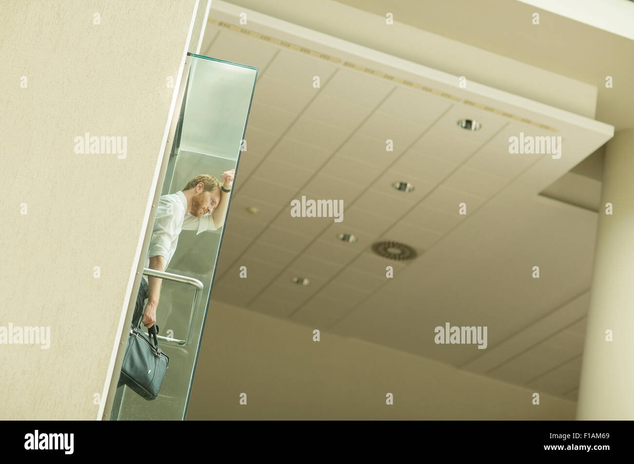 Man in an elevator hi-res stock photography and images - Alamy
