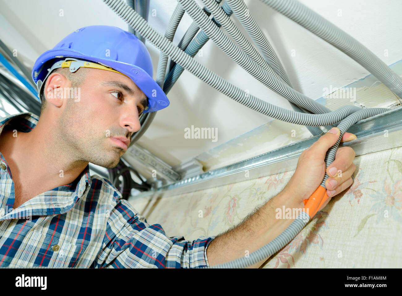 Skilled electrician wiring a house Stock Photo - Alamy