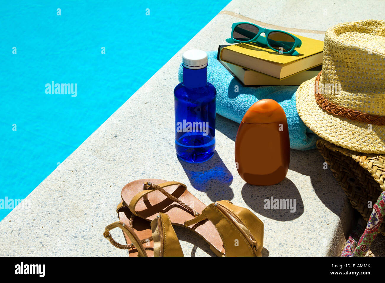 Reading near the swimming pool Stock Photo - Alamy