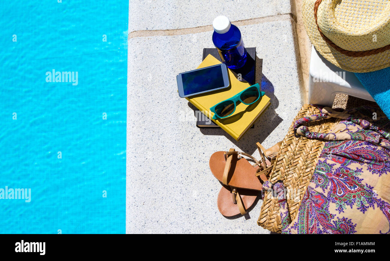Reading near the swimming pool Stock Photo - Alamy