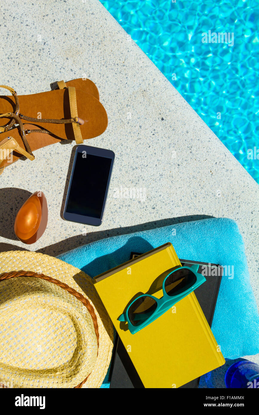 Reading near the swimming pool Stock Photo - Alamy