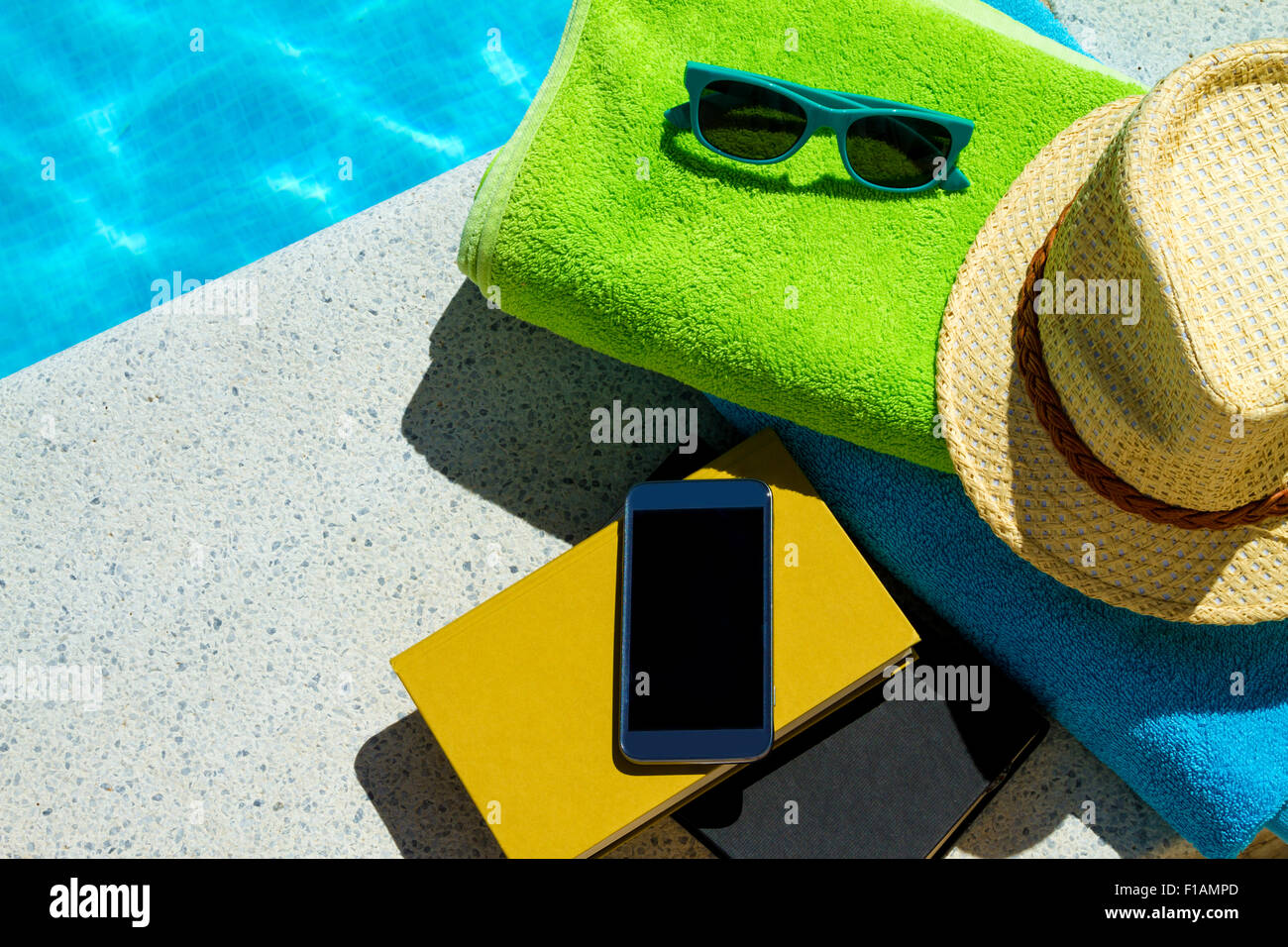 Reading near the swimming pool Stock Photo - Alamy