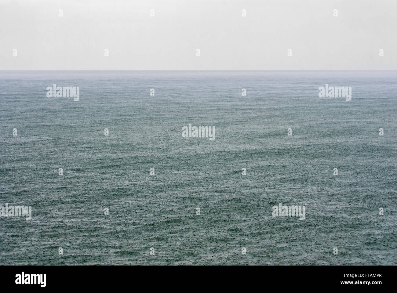 Rain shower on open sea Stock Photo - Alamy