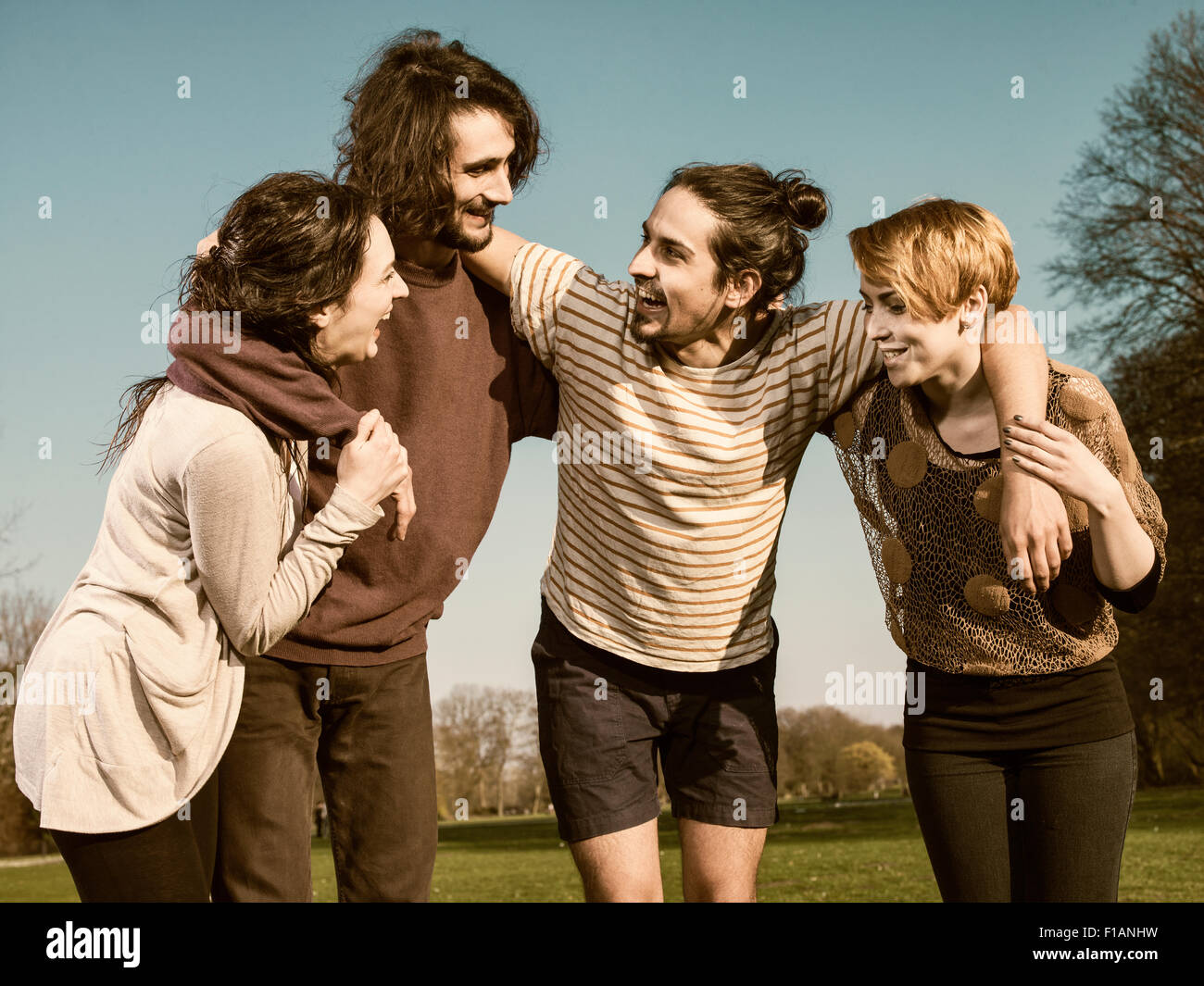 Group of four friends having fun Stock Photo - Alamy