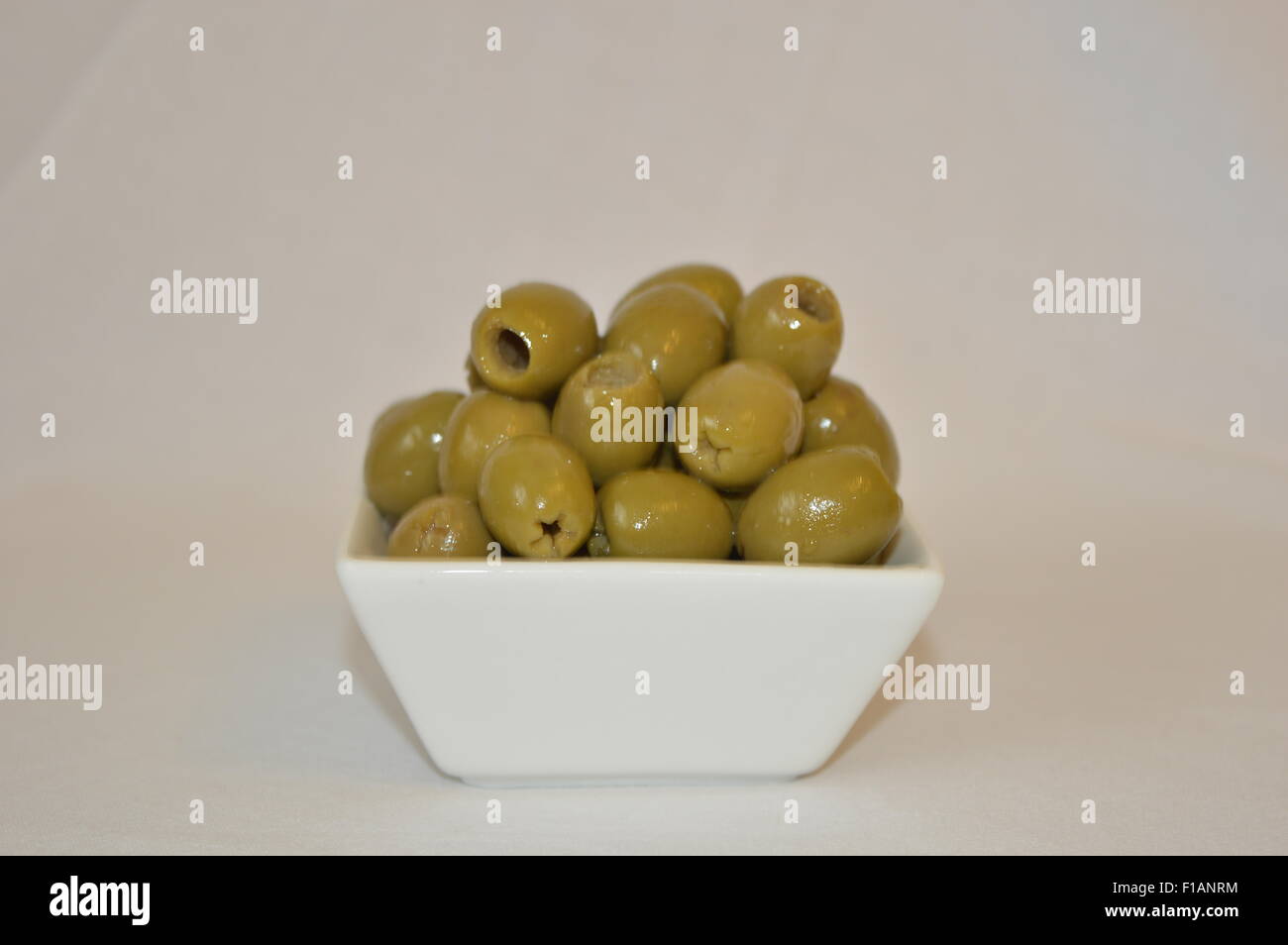 Pitted green olives Stock Photo - Alamy