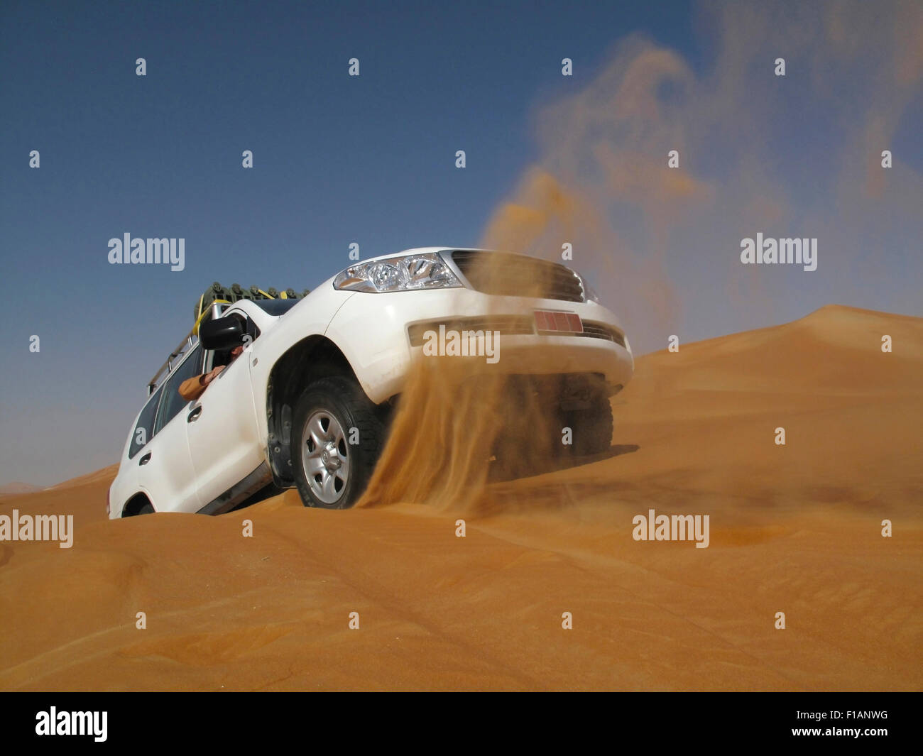 United Arab Emirates, Abu Dhabi, Jeep in desert, getting stuck Stock ...