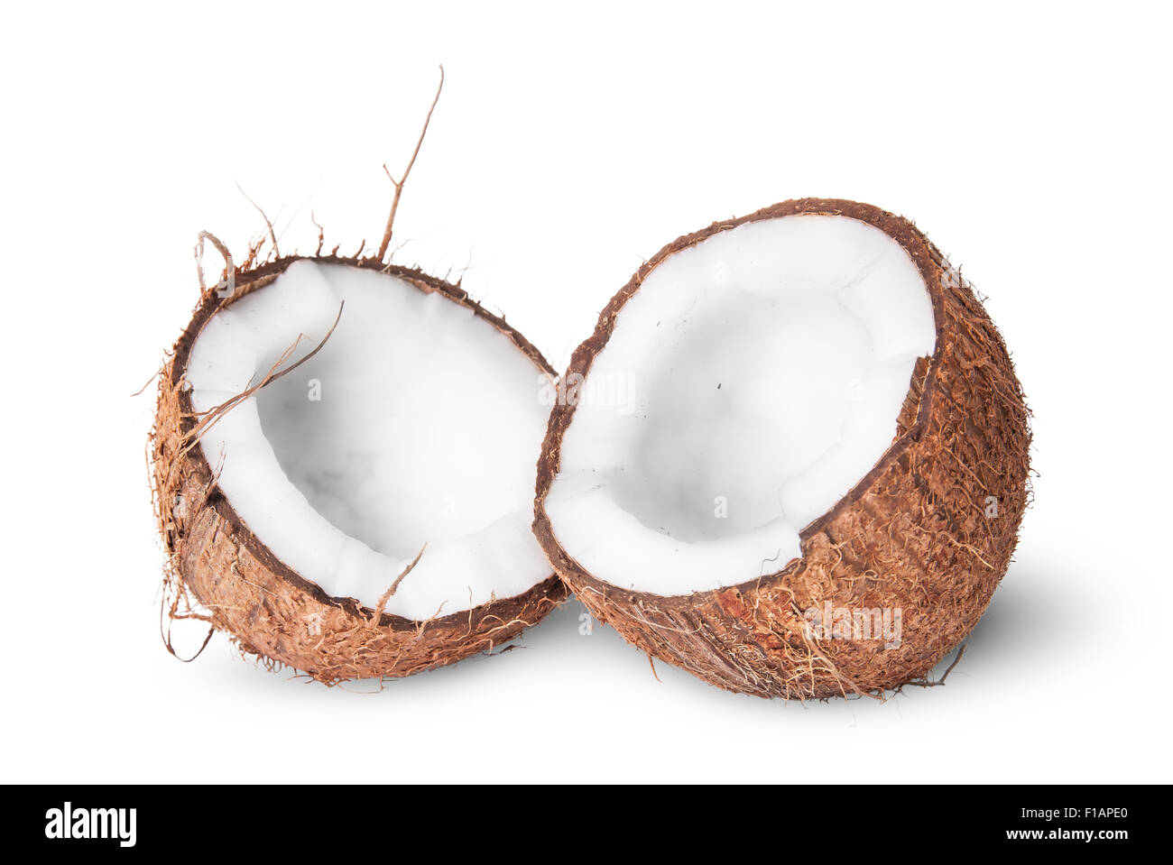 Two halves of coconut isolated on white background Stock Photo - Alamy