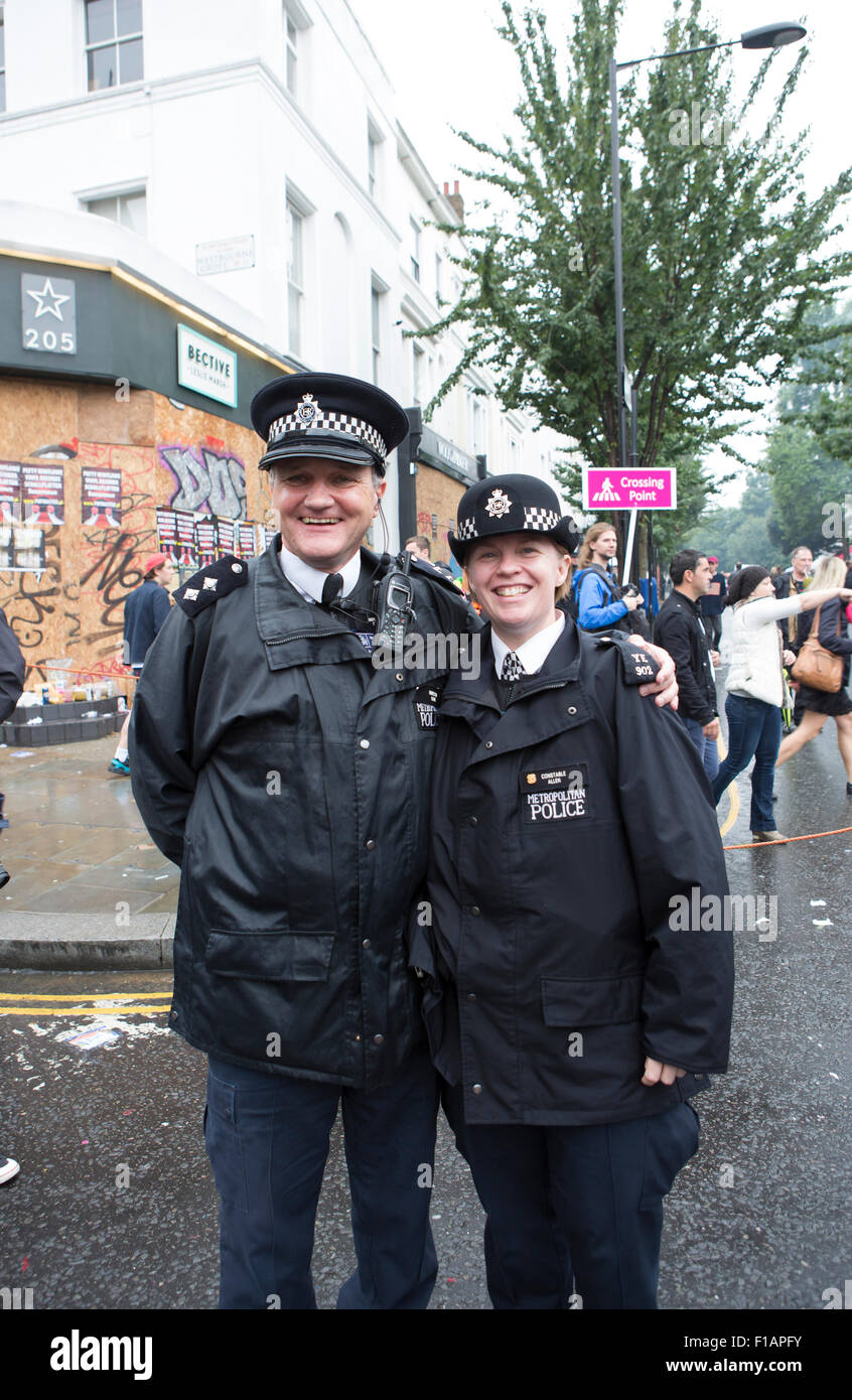 Notting Hill, UK. 31st August, 2015. Happy Police officers pose at the ...