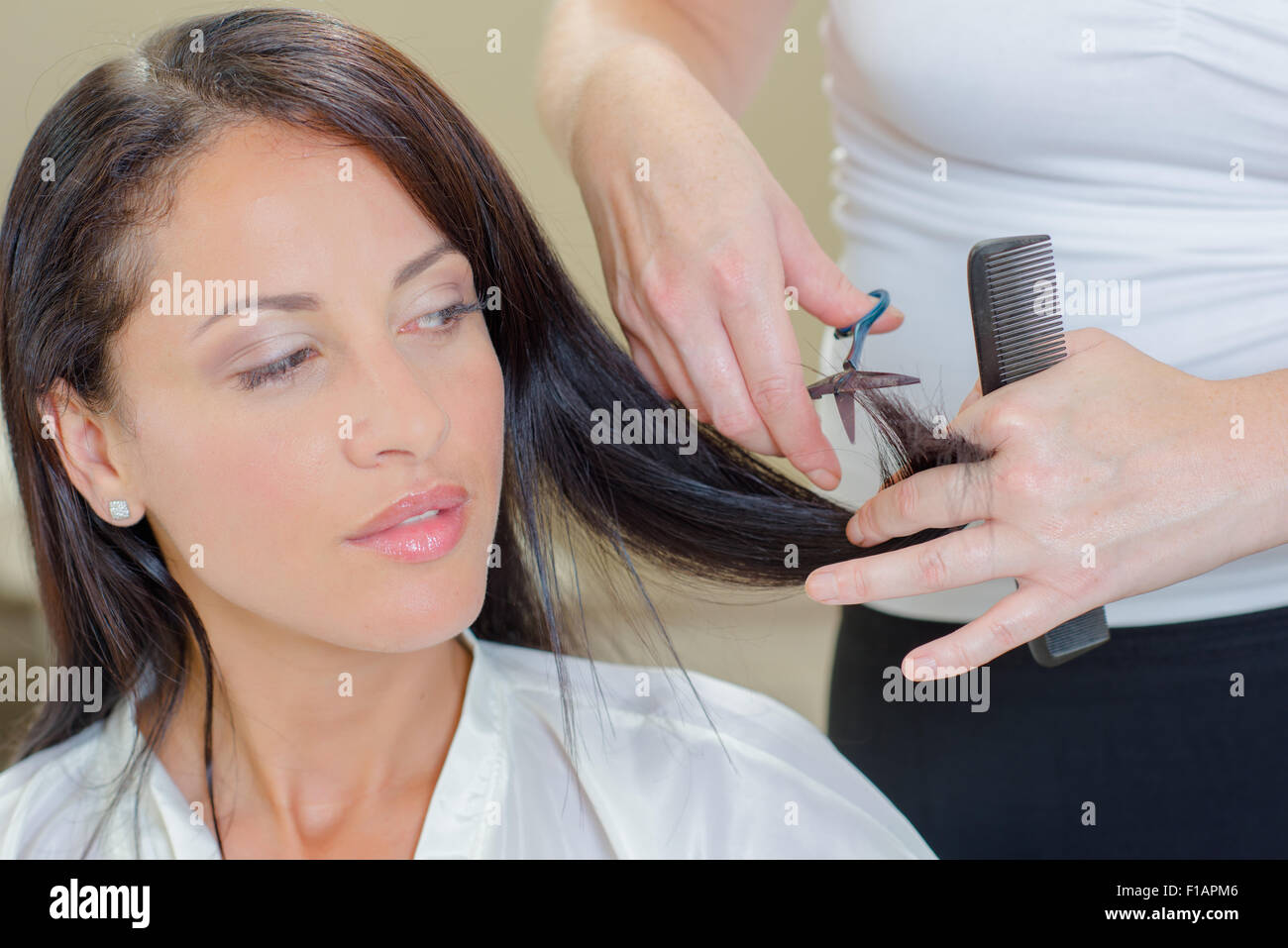 Having her hair cut as a treat Stock Photo - Alamy