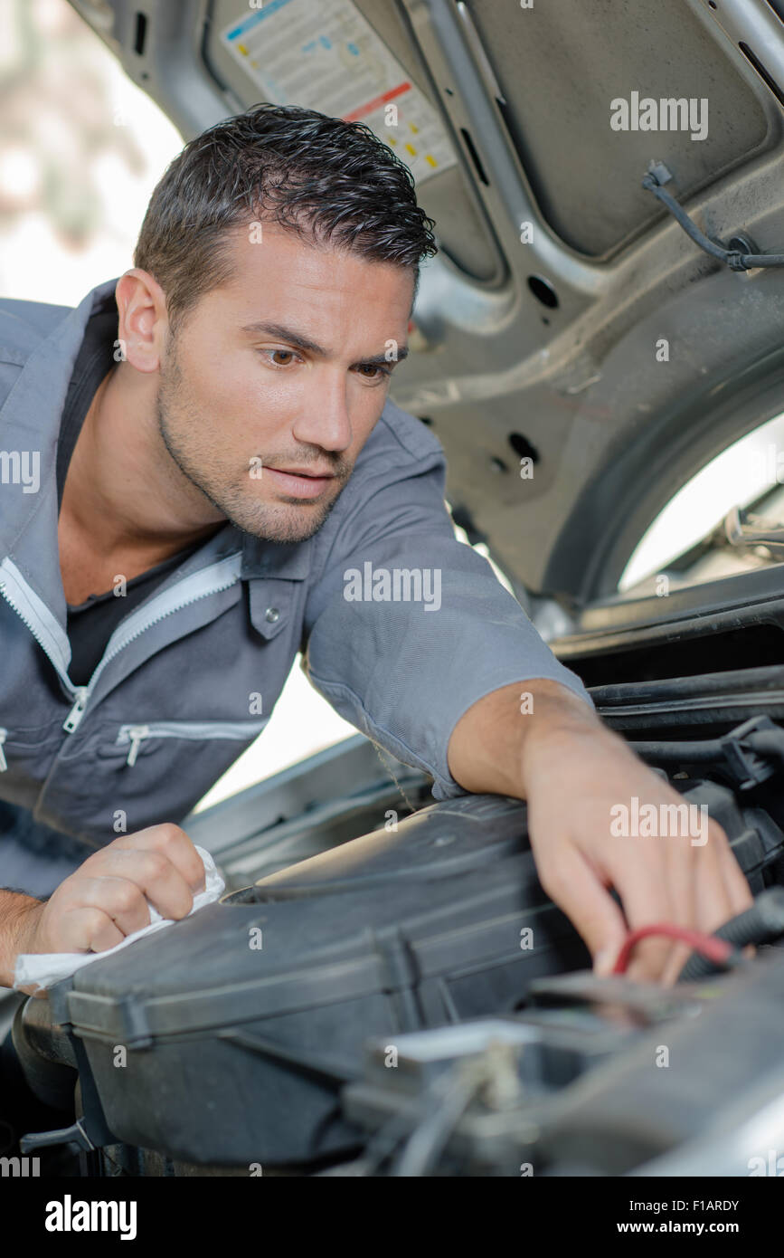 Man fixing a car engine Stock Photo - Alamy