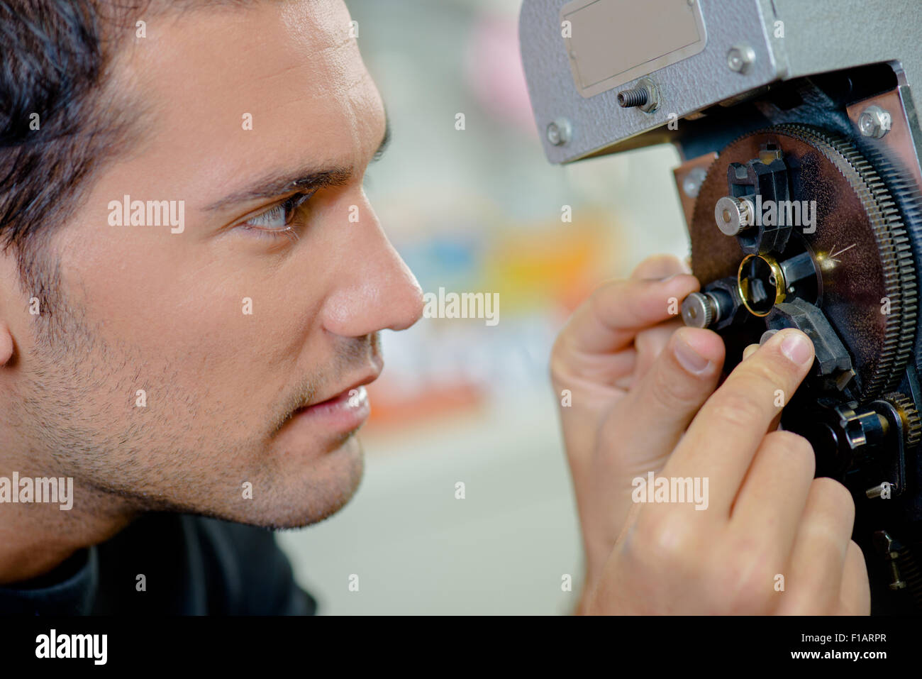 Man adjusting dial Stock Photo - Alamy