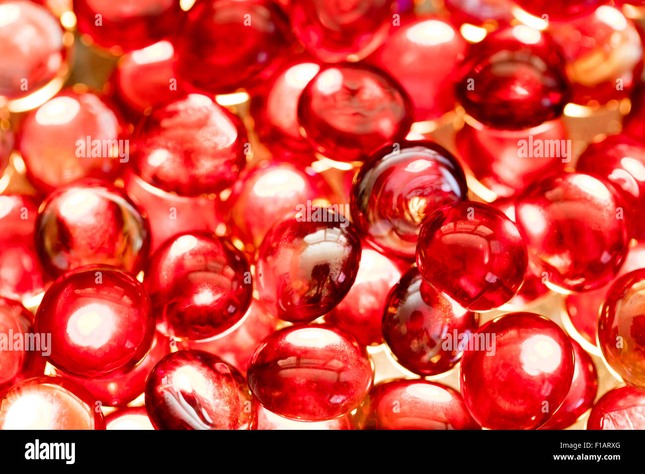 Red glass spheres creating a bubble effect with filtered light Stock ...