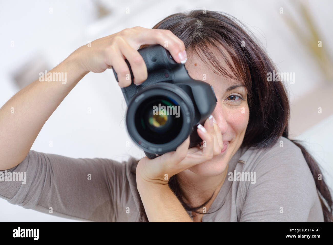 Lady taking photograph Stock Photo - Alamy