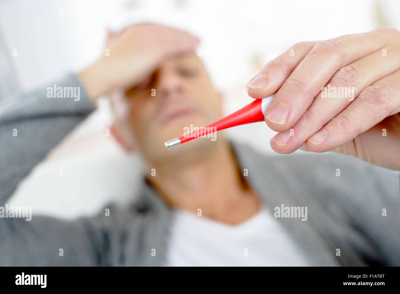 Man running a fever Stock Photo - Alamy