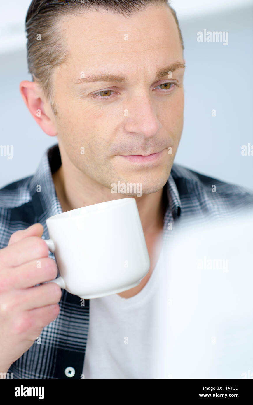 Man holding cup Stock Photo - Alamy