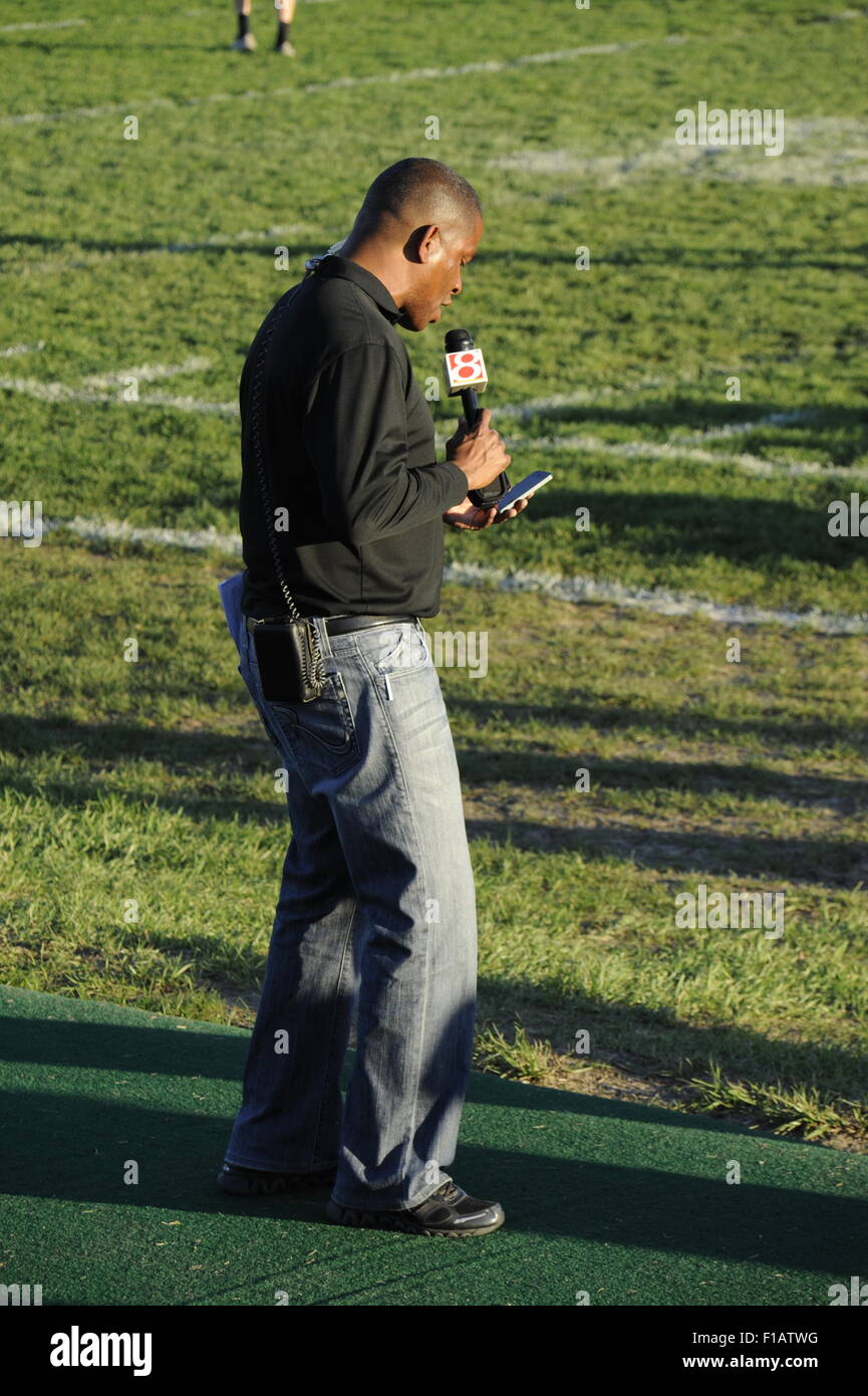 African-American radio newscaster for high school football game Stock ...
