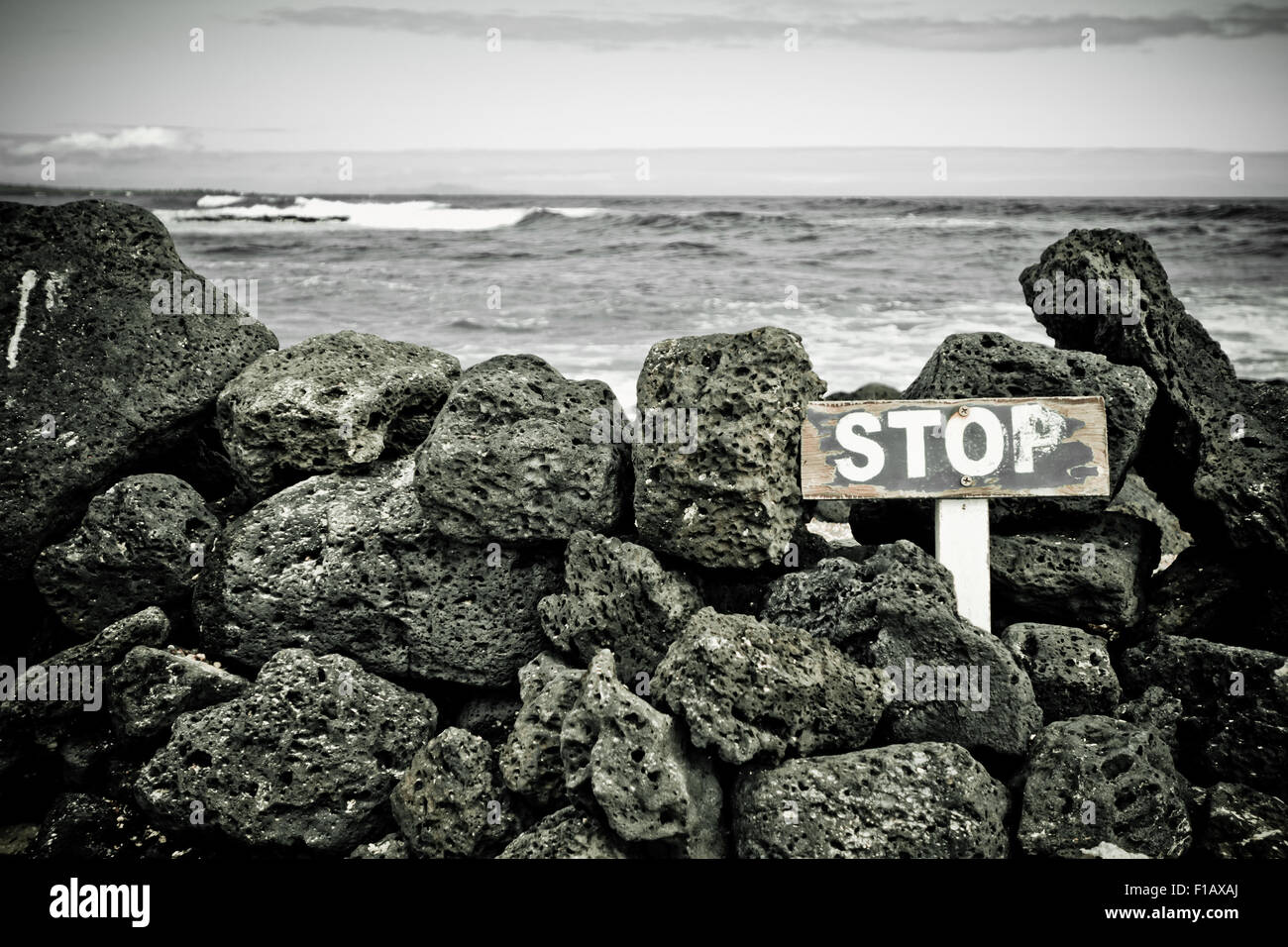 old wooden stop sign warning about a protected beach area in galapagos ...