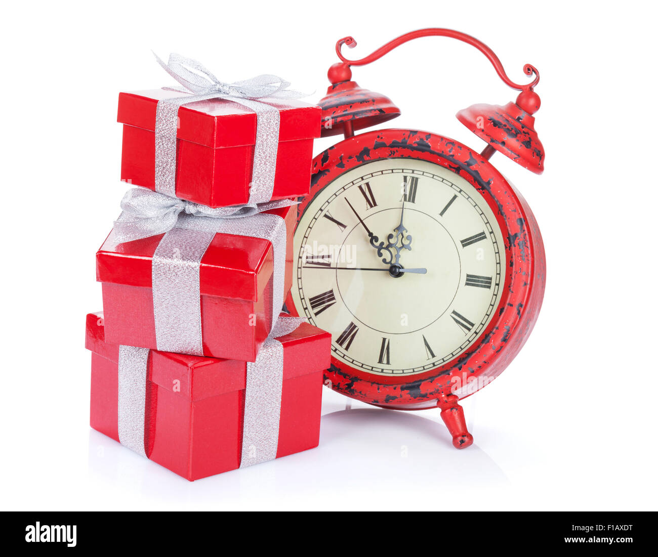 Christmas clock and three gift boxes. Isolated on white background ...