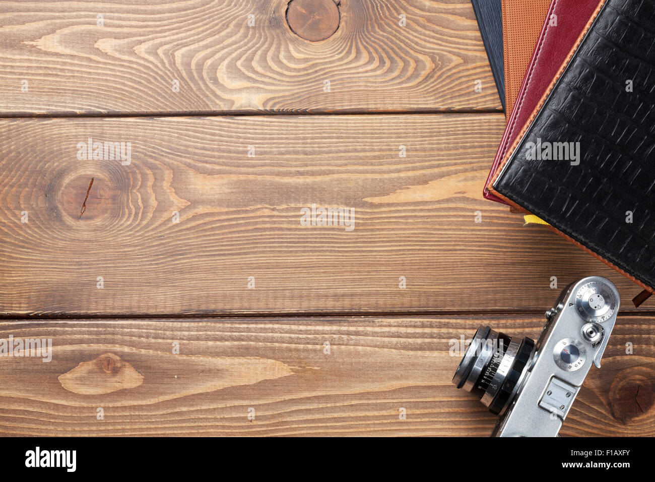 Office desk table with camera and notepad. Top view with copy space ...
