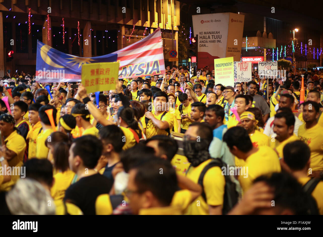KUALA LUMPUR, MALAYSIA, 29 AUG 2015 : Yellow shirt malaysian holding ...