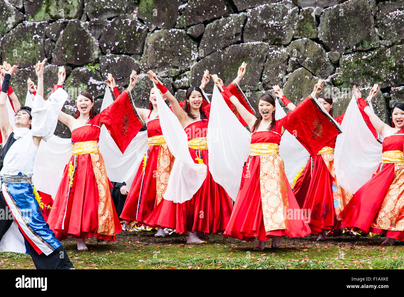 Japanese yosakoi dance team dancing in front of castle stone wall ...