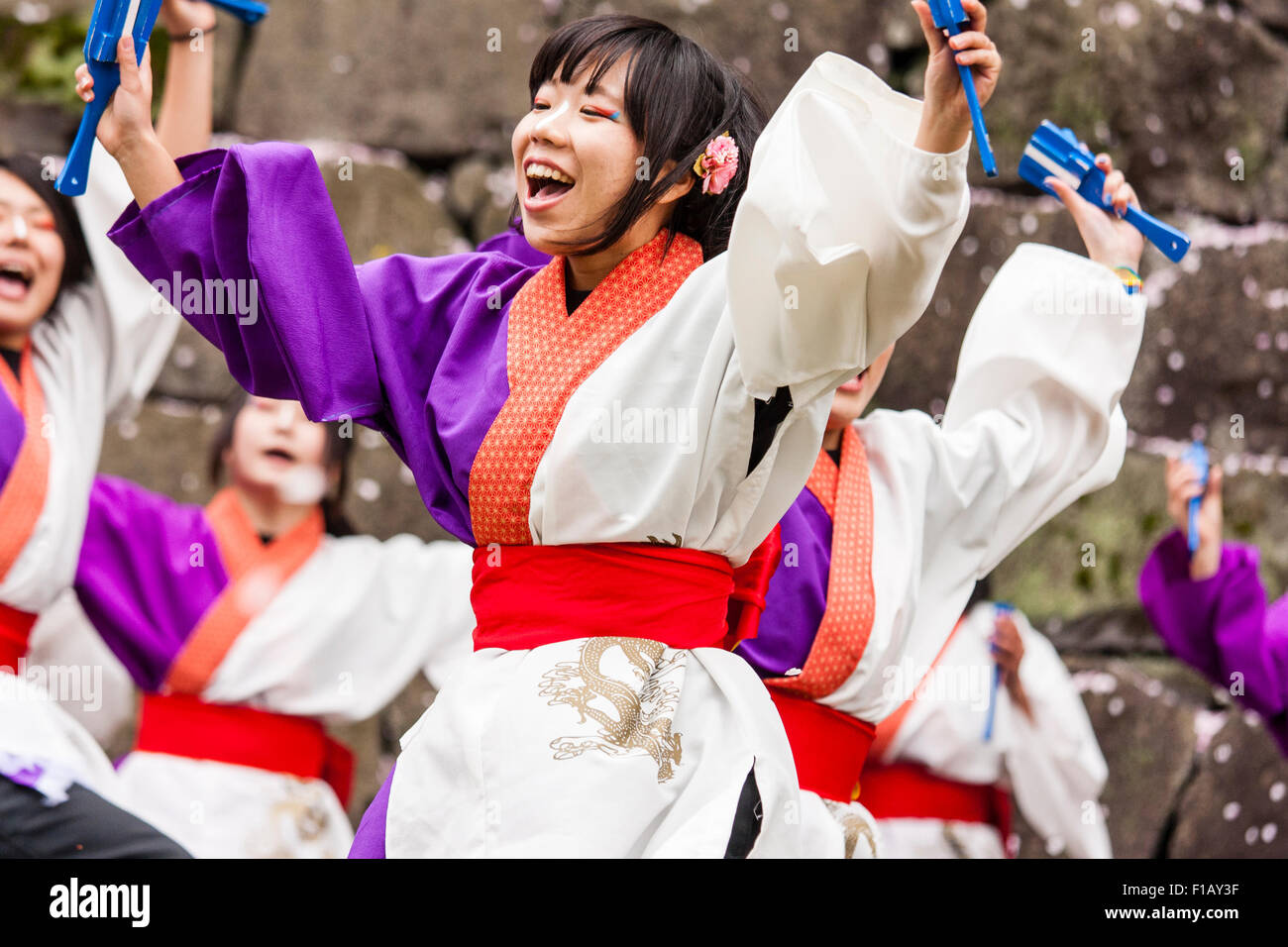 Japanese yosakoi dance festival at Kumamoto. Young women, holding ...