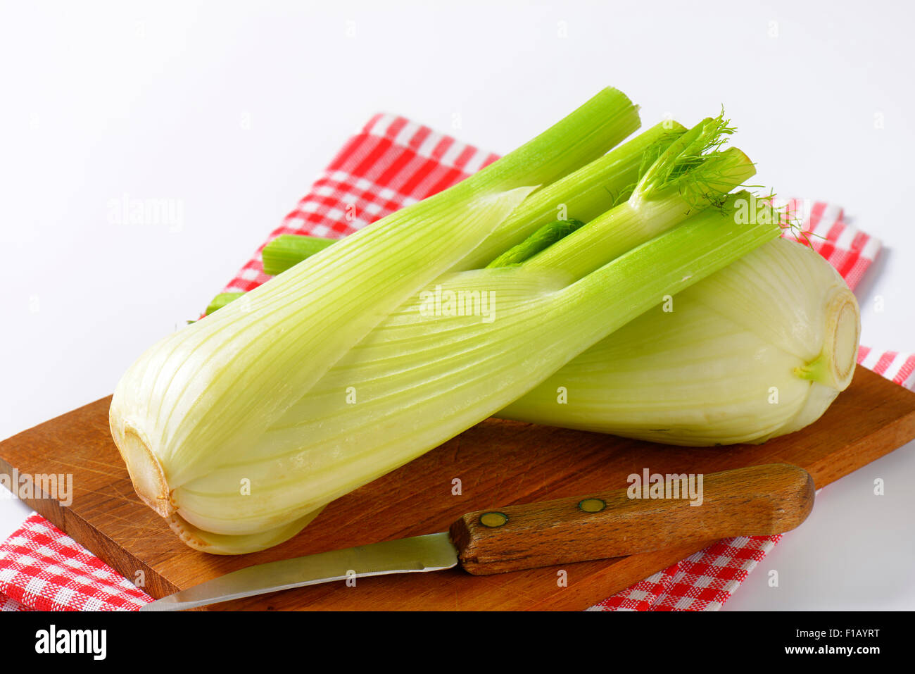 bulbs of fresh fennel on wooden cutting board Stock Photo - Alamy
