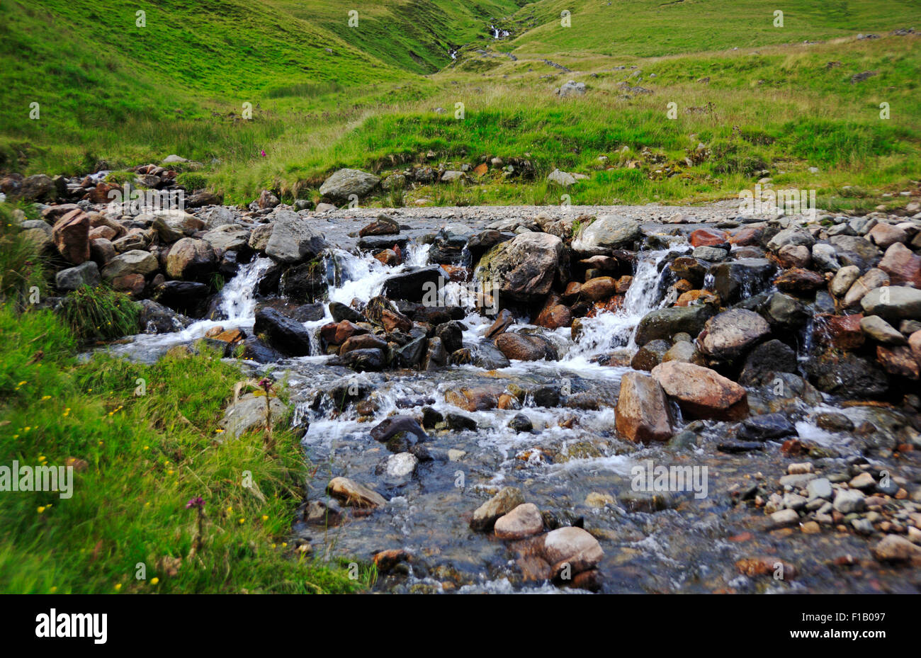 A view of a small waterfall on the Glas Burn before entering the River ...