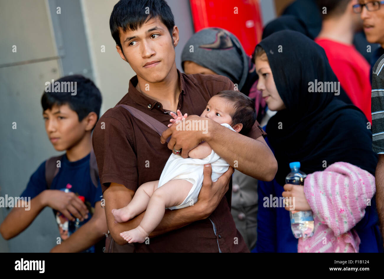 Munich, Germany. 31st Aug, 2015. An Afghan family arrives by train from ...