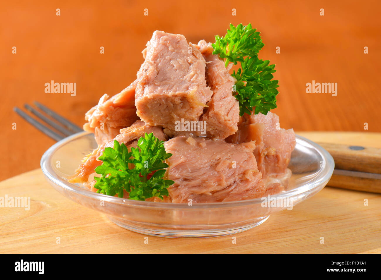 chunks of canned tuna in glass bowl Stock Photo - Alamy