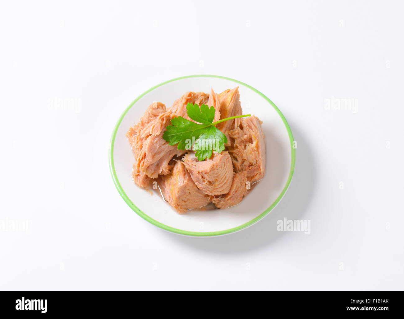 chunks of canned tuna on white plate Stock Photo - Alamy