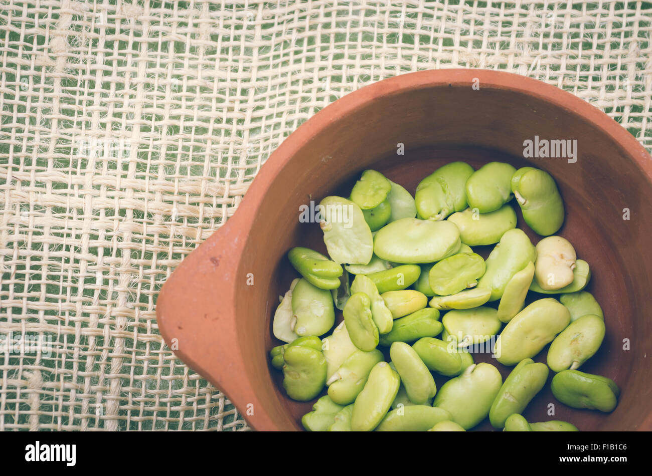 lima beans inside ceramic terracota bowl and rustic background Stock ...