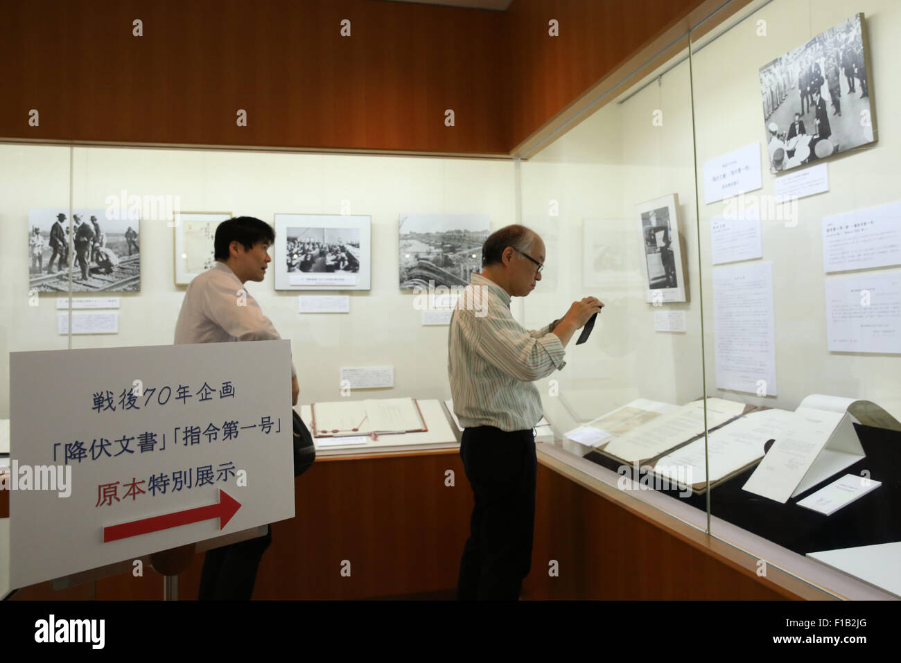 Tokyo, Japan. 1st Sep, 2015. Visitors look at the original Instrument ...