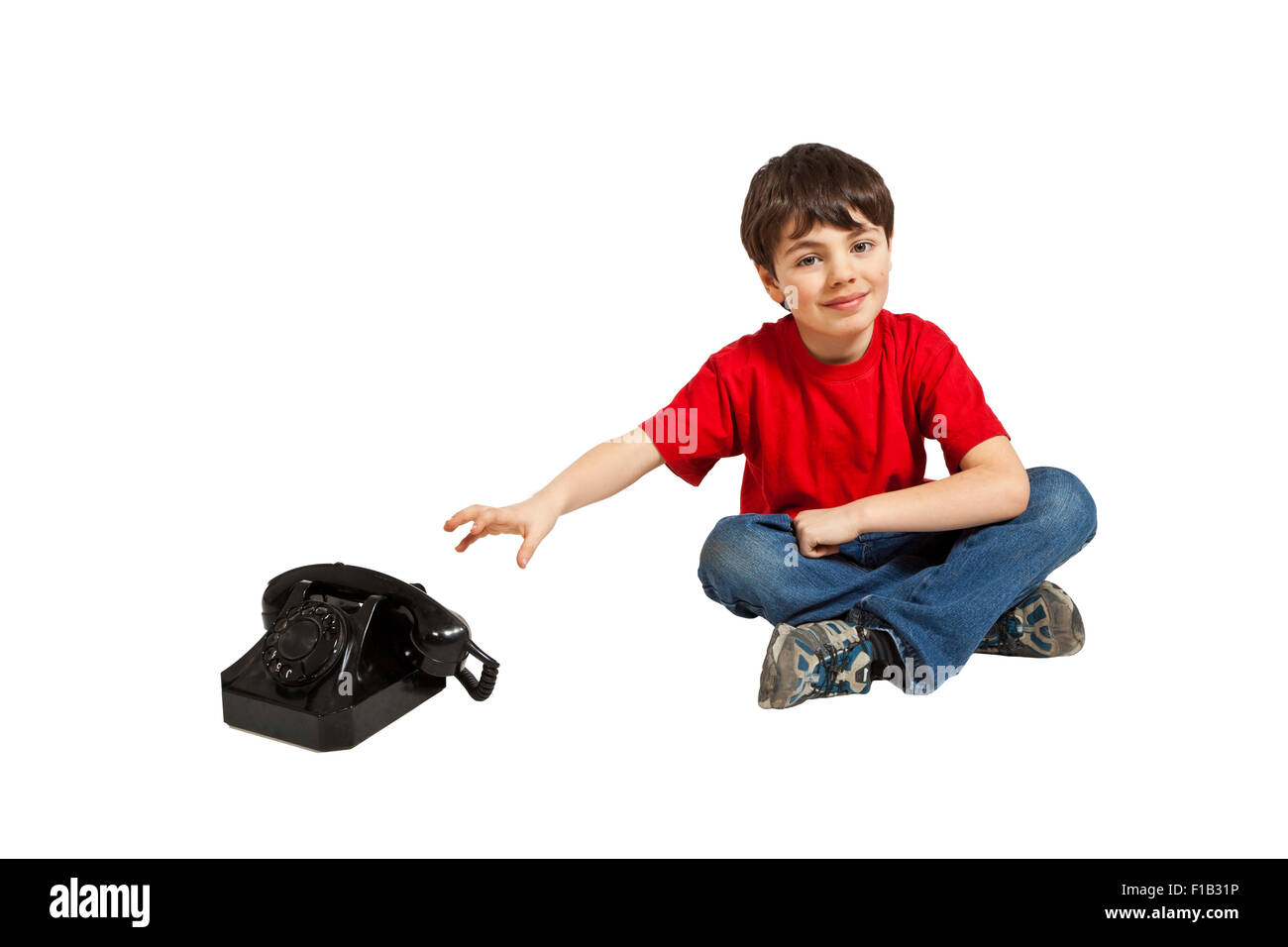 little boy expecting a phone call Stock Photo - Alamy
