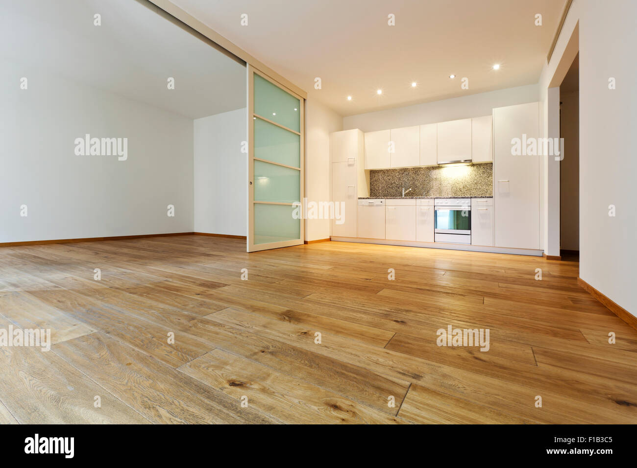 interior empty house with wooden floor, kitchen Stock Photo - Alamy