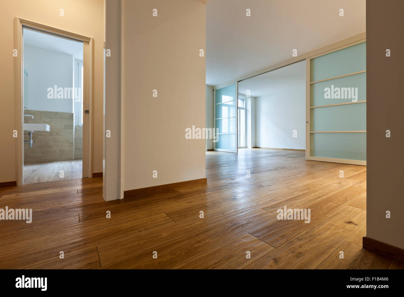 interior empty house with wooden floor, passage Stock Photo - Alamy