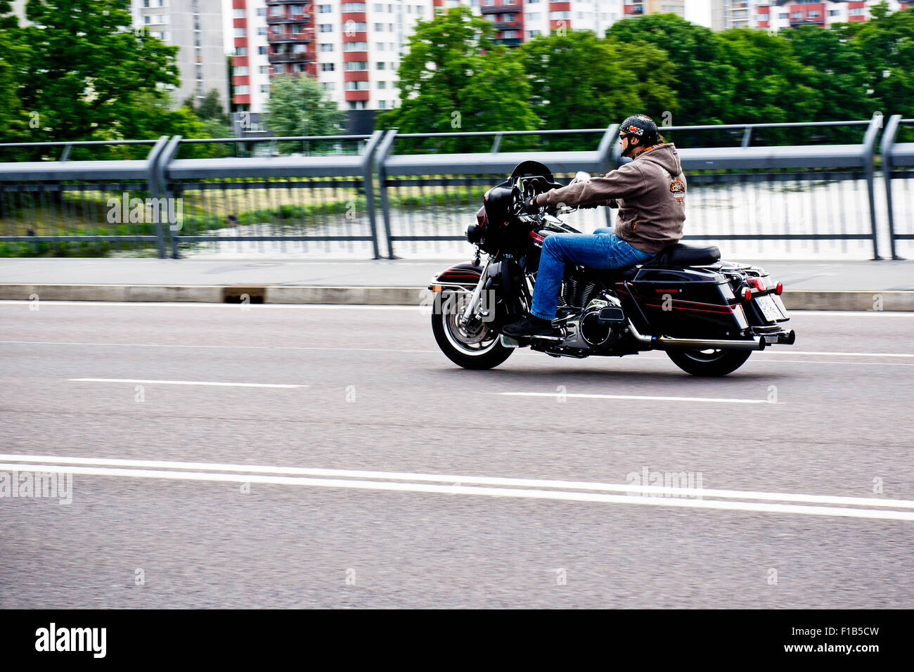 Man riding motorcycle on street hi-res stock photography and images - Alamy