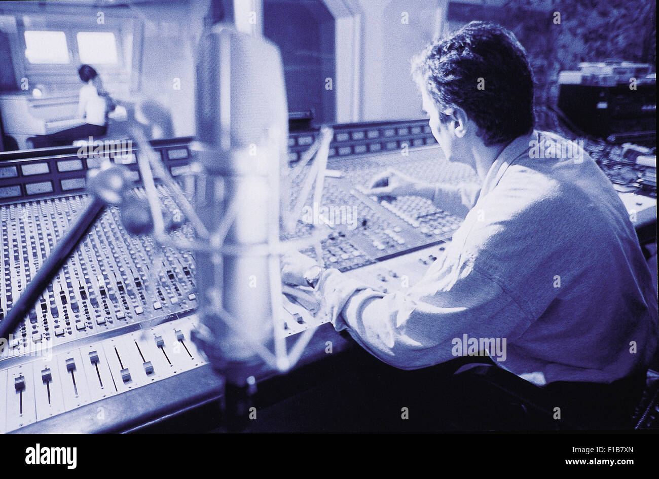 Hamburg, Germany, a sound engineer at the mixing console in a recording ...