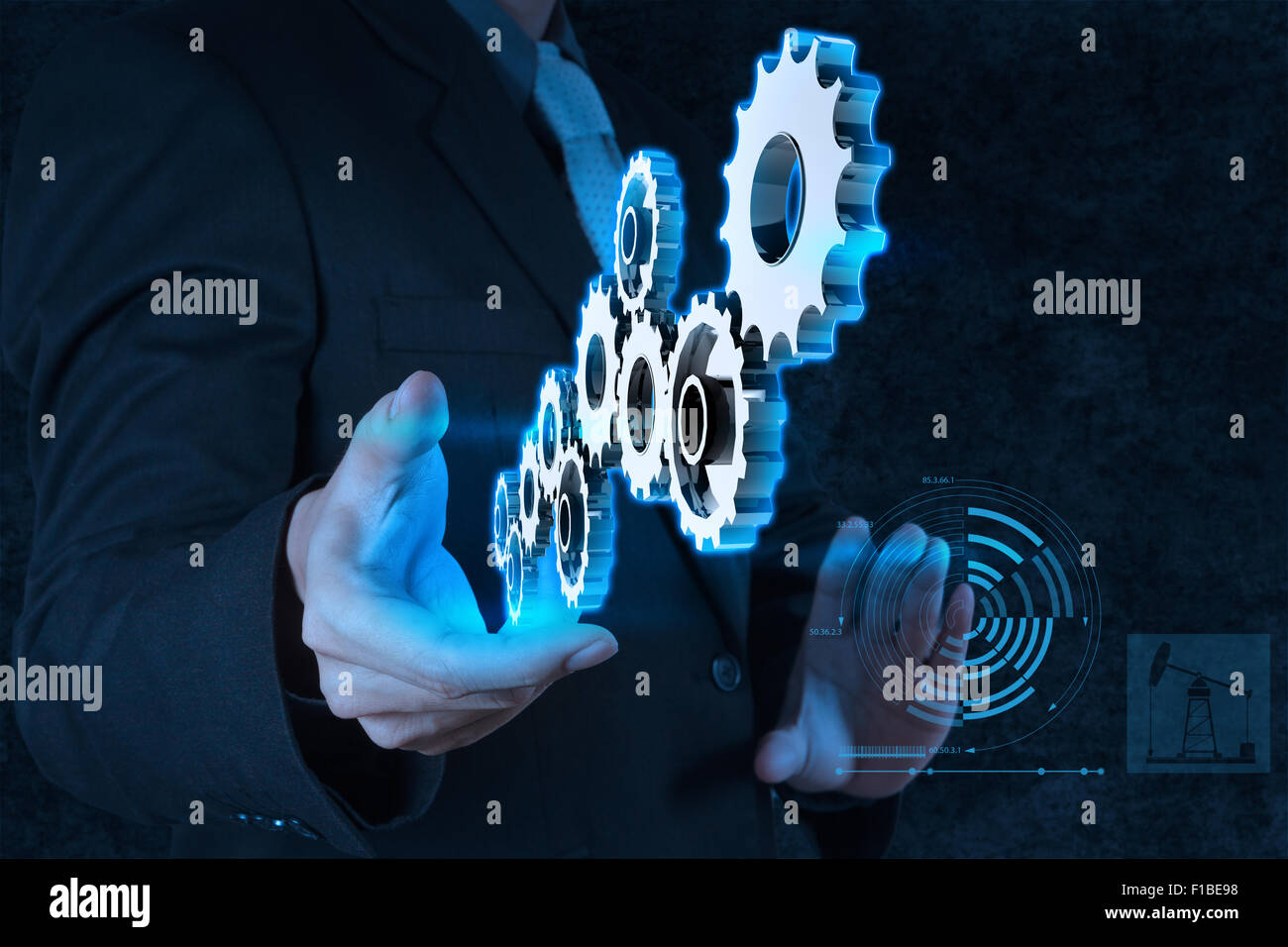 businessman hand shows gear to success as concept Stock Photo - Alamy