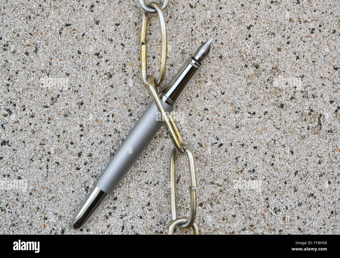 Fountain pen and chain as concept about controlling the media Stock ...
